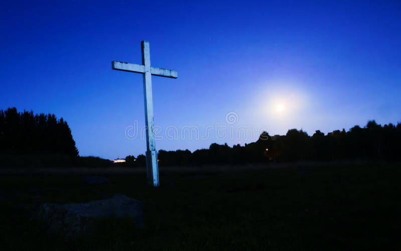 Cross at Night Against Sky, Moon in Background Stock Photo - Image of ...