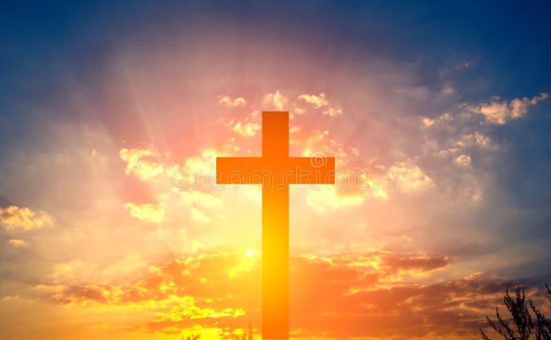 Cross in the Rays of the Sun Against a Blue Cloudy Sky Stock Image ...
