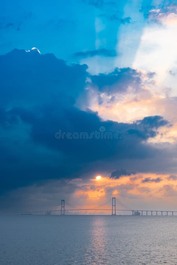 Cross-sea Bridge at Sunrise with Beautiful Clouds at Vertical ...