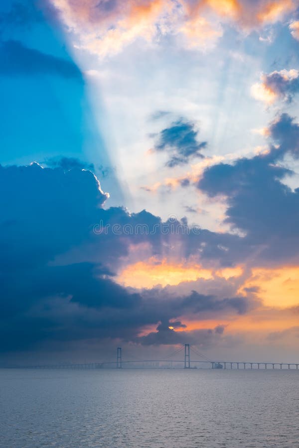 Cross-sea Bridge at Sunrise with Beautiful Clouds at Vertical ...