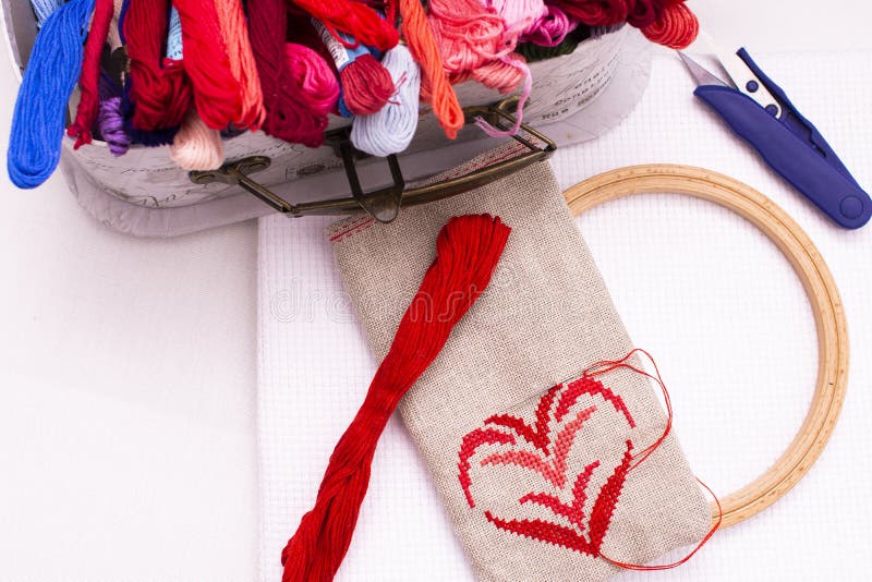 Cross stitch, red color stock photo. Image of detail - 146548186