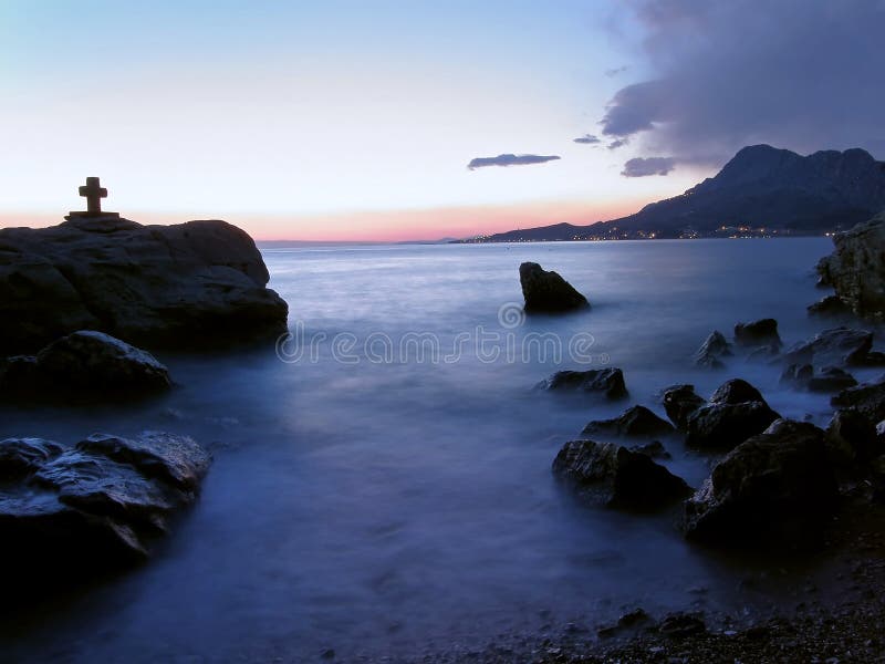 Cross, sunset at sea stock image. Image of horizon, breath - 15794721