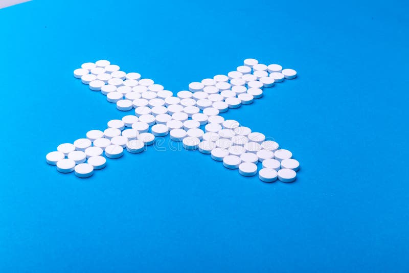 Cross of Tablets on a Blue Background Stock Image - Image of science ...
