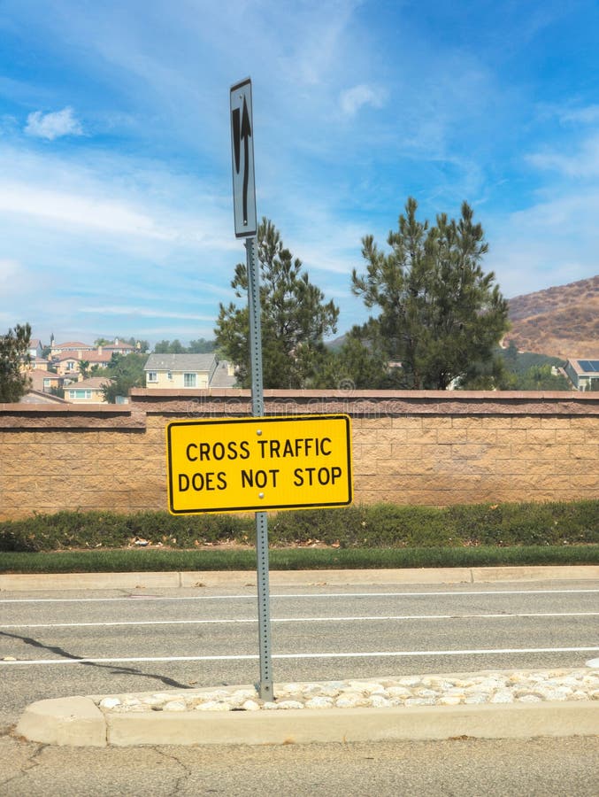 Cross Traffic Does Not Stop Warning Sign Stock Photo - Image of ...
