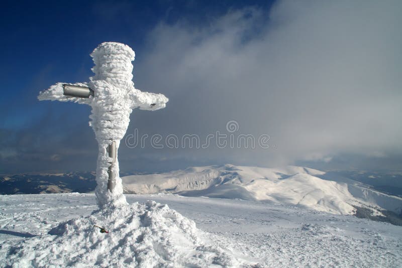 Cross on the winter summit stock image. Image of color - 11896351