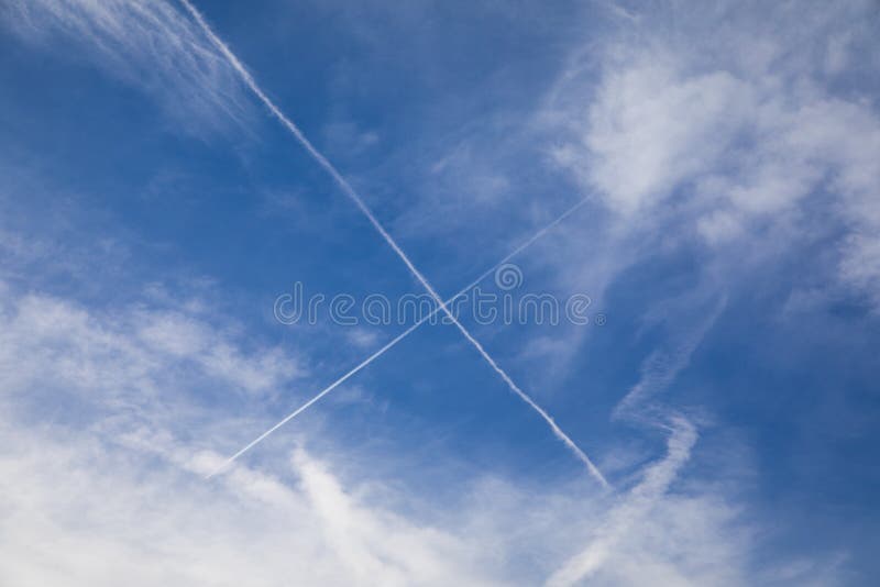 Crossed Airplane Trails stock photo. Image of white, clouds - 89847644