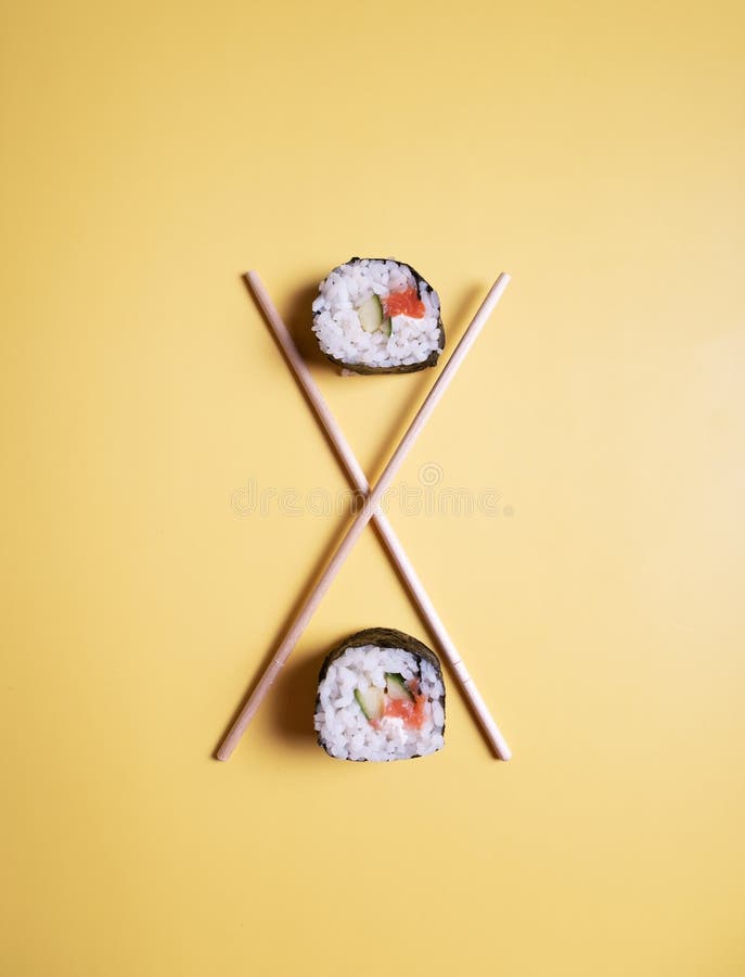 Crossed Chopsticks for Sushi from Rice, Fish and Cucumber with Cheese ...