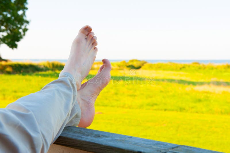 Crossed feet stock photo. Image of lifestyle, beach, legs - 59223184