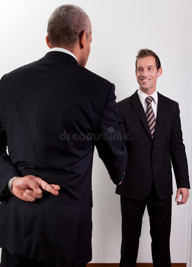 Crossed Fingers at Handshake Stock Photo - Image of confidence, deceit ...