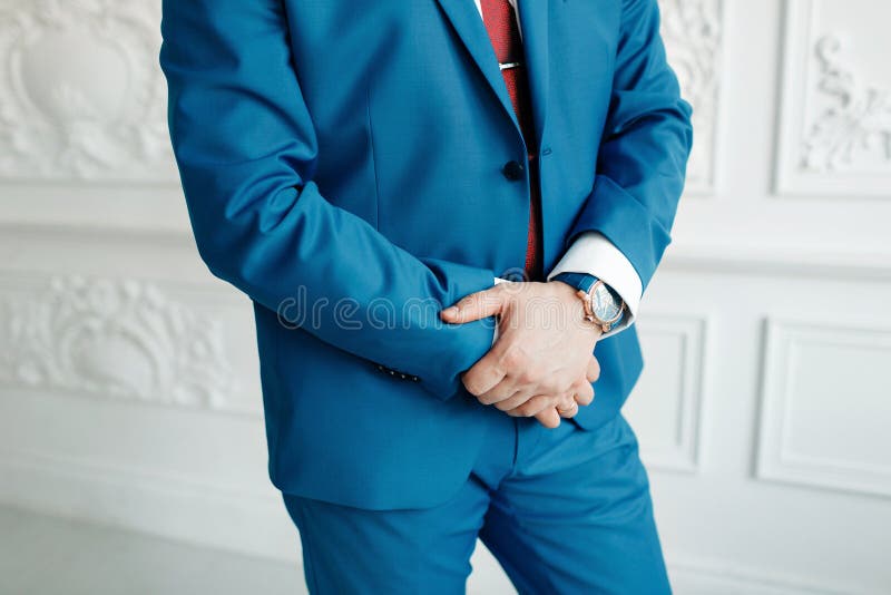 Crossed Man`s Hands in a Blue Jacket. Cuff and Hand Watch Mechanical ...