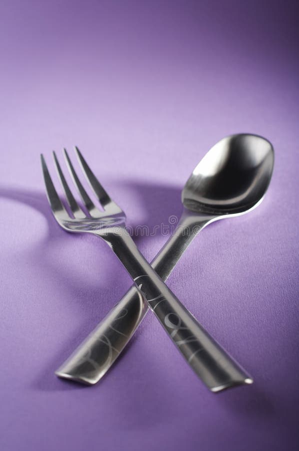 Crossed spoon and fork stock photo. Image of utensil, knife - 2420154