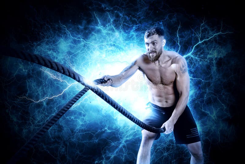 Young Athlete Doing Battle Ropes Exercise at the Crossfit Gym Stock ...