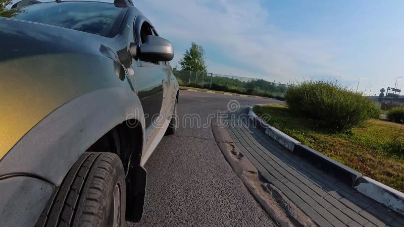 The Crossover Drives through a Roundabout and Onto a Straight Road ...