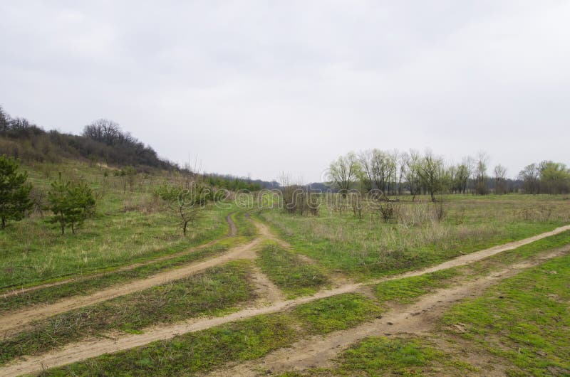 Crossroads in the Field at Sunset. Split Country Road. Beautiful Clouds ...