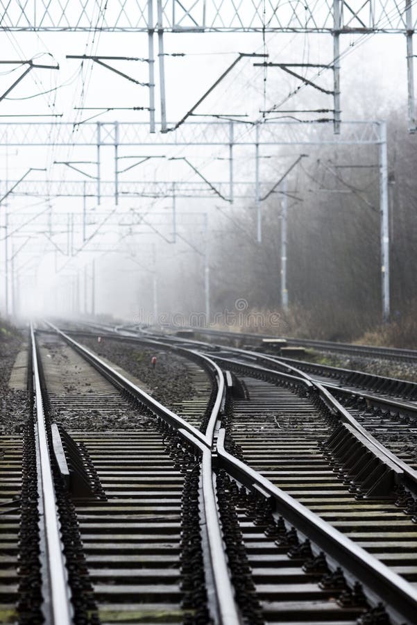 Crossroads of Railway Tracks in the Fog Stock Photo - Image of mist ...