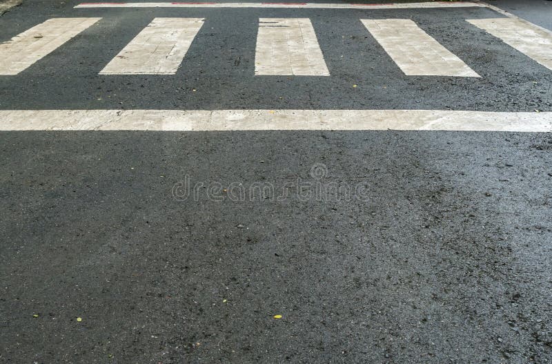 Crosswalk on asphalt road stock photo. Image of pattern - 77642526
