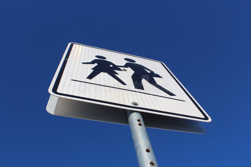 Crosswalk Sign Against Blue Sky Stock Photo - Image of pedestrian ...