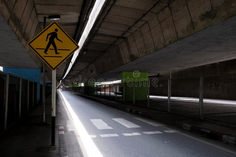 Crosswalk and Sign Under Overpass. Stock Photo - Image of asphalt ...