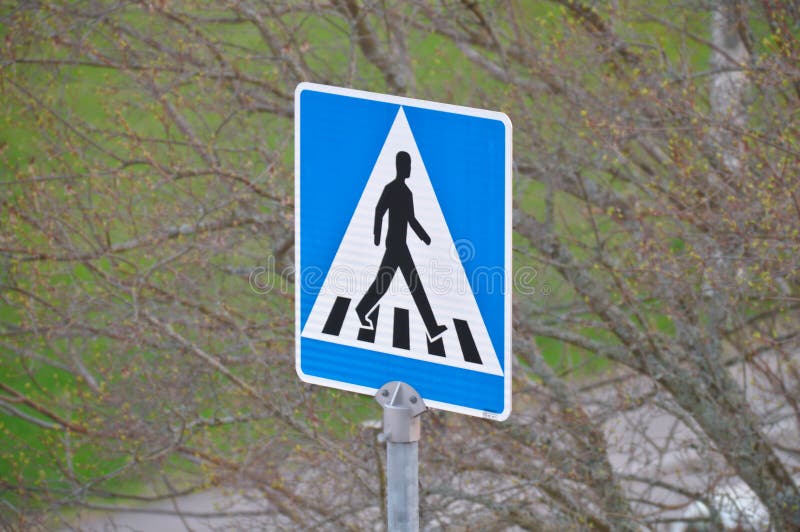 Crosswalk Caution Sign with Person in Full Kandora Stock Image - Image ...