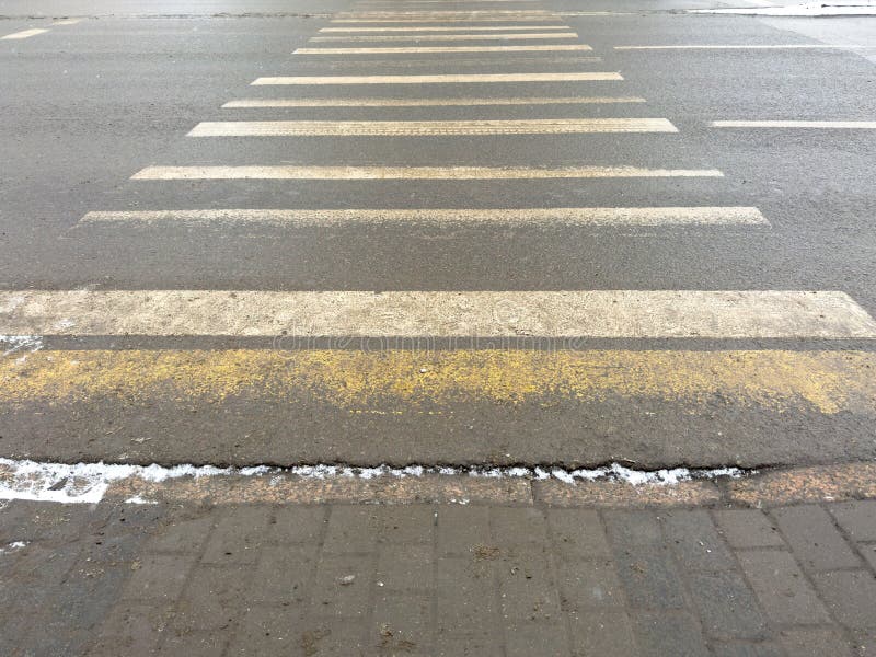 A Crosswalk with a Yellow Line on the Road Stock Photo - Image of road ...