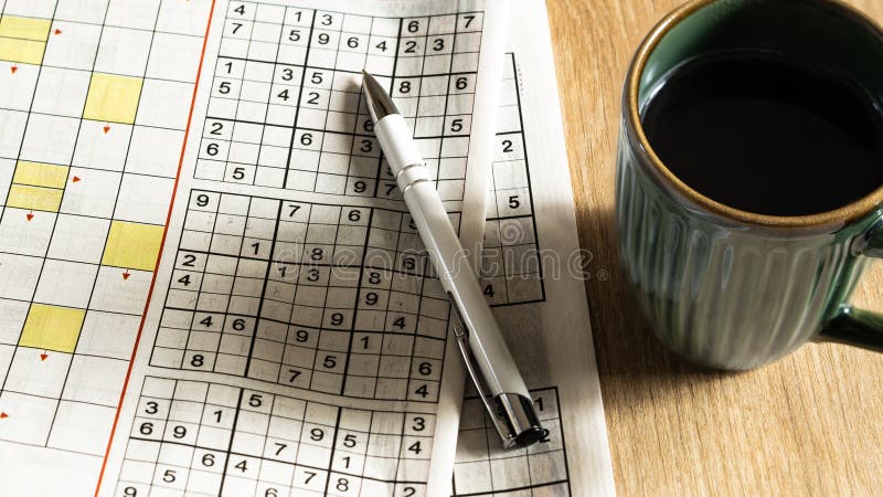 Crossword Paper with Pen and Coffee Cup Stock Image - Image of table ...