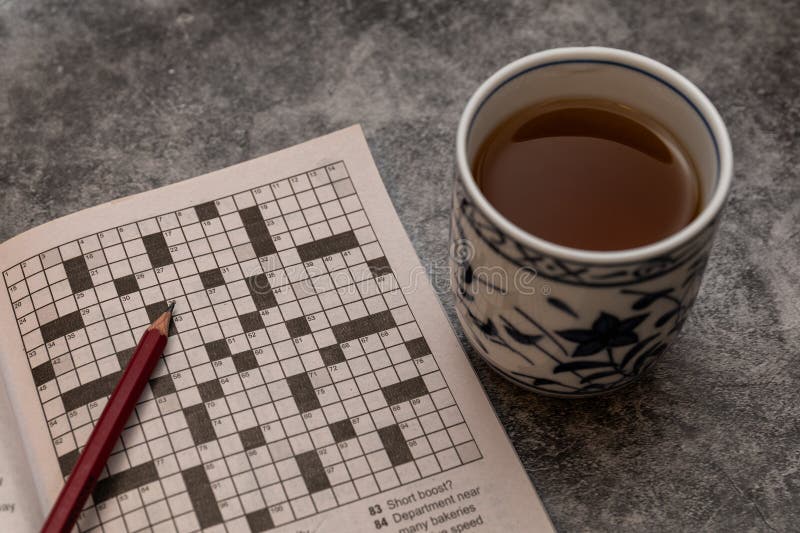Crossword Puzzle with Cup of Tea and a Pencil. Stock Photo - Image of ...