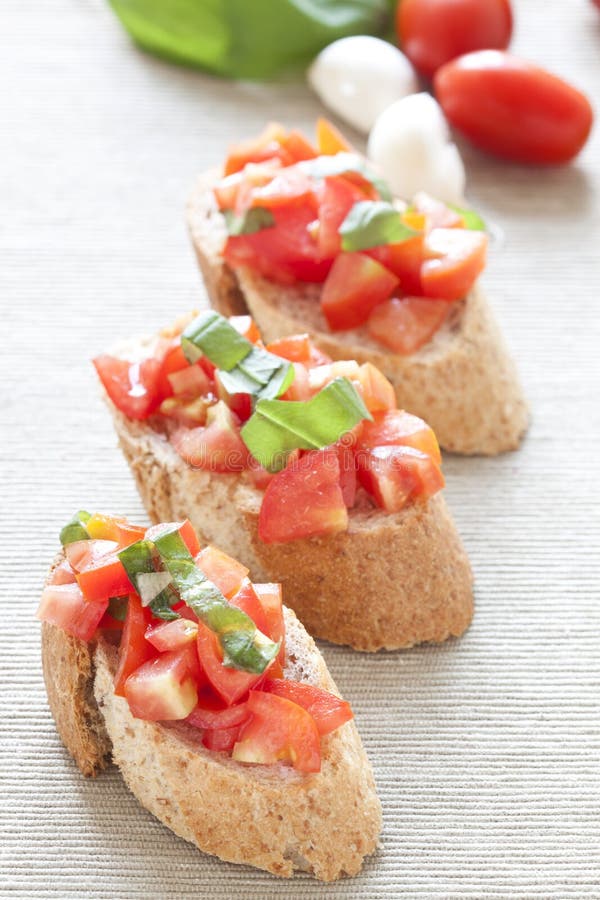Crostini with Tomato, Basil and Garlic Stock Image - Image of appetizer ...