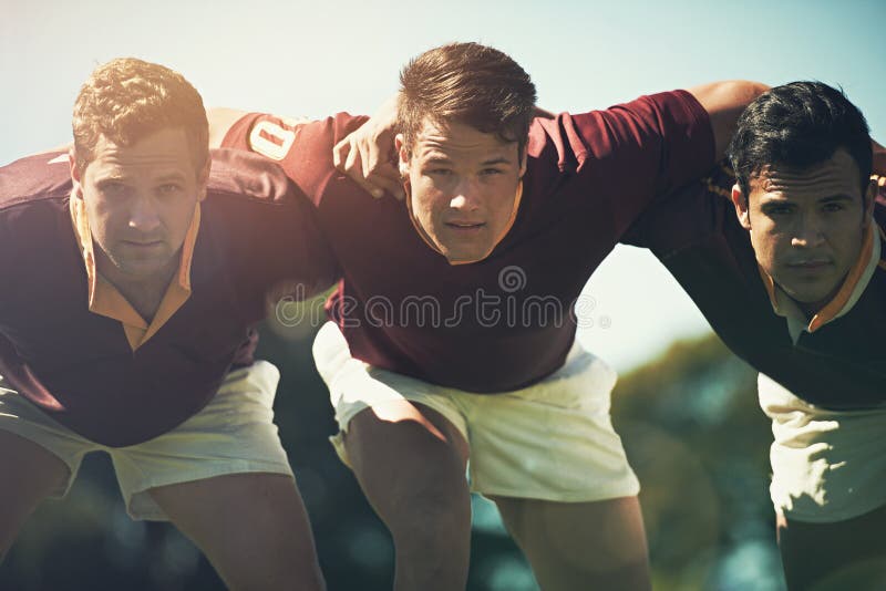 Crouch, Touch, Pause, Engage. Portrait of a Young Rugby Team Lining Up ...