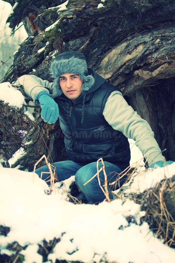 Crouching Handsome Young Man in Winter Stock Image - Image of nature ...