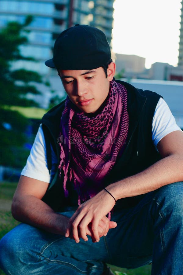 Crouching Looking Down stock photo. Image of young, urban - 10195314