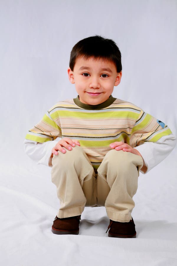 Crouching boy stock image. Image of portrait, groomed - 1724033