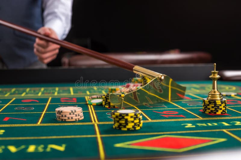 Croupier Collects Chips Using Stick in Casino. Stock Image - Image of ...