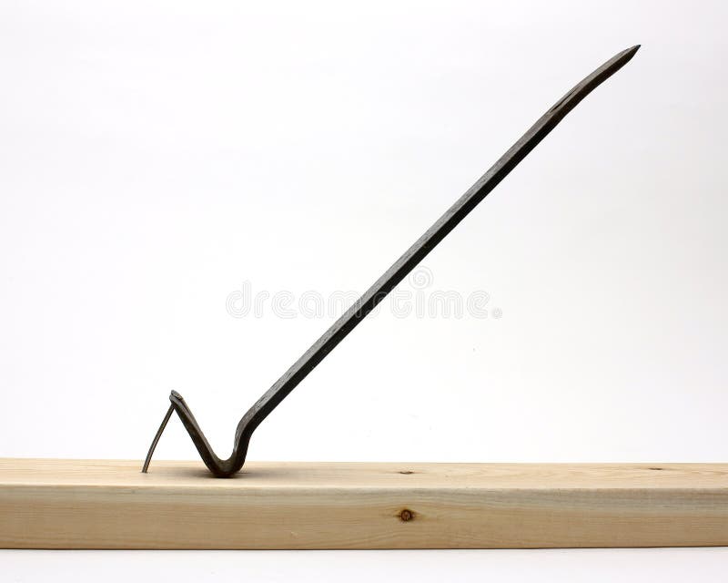 Crow bar pulling a nail stock image. Image of white, tool - 13538317