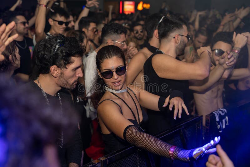 Crowd of Cheerful Young People Having Fun during Techno Party ... Crowd of Cheerful Young People Having Fun during Techno Party ...