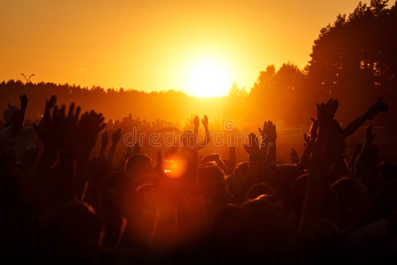 Crowd Dancing on the Summer Party. Low Sun Orange Light Stock Photo ...