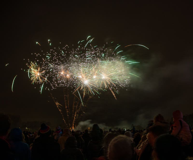 Crowd Enjoying the Beautiful Fireworks at Night during an Outdoor Event ...