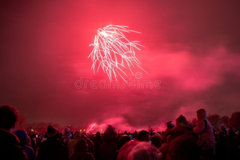 Crowd Enjoying the Beautiful Fireworks at Night during an Outdoor Event ...