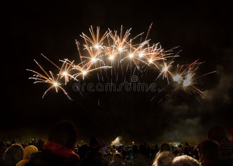 Crowd Enjoying the Beautiful Fireworks at Night during an Outdoor Event ...