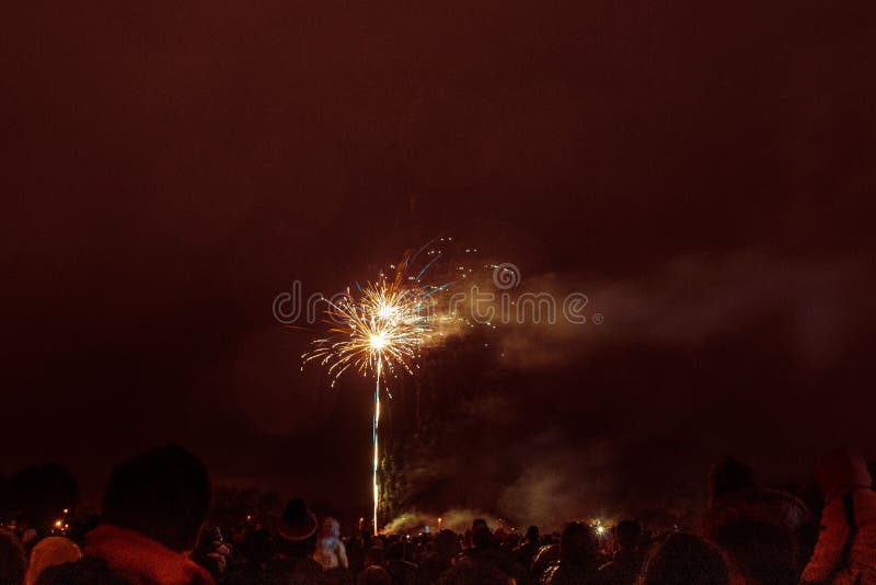 Crowd Enjoying the Beautiful Fireworks at Night during an Outdoor Event ...