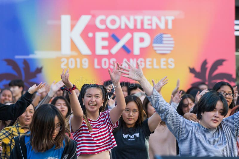 Crowd of Fans of KPop Participating in a Group Dance Activity Called ...