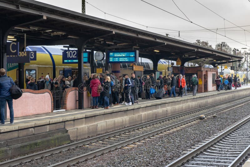 The Crowd of People is Waiting for the Next Train on the Platform in ...