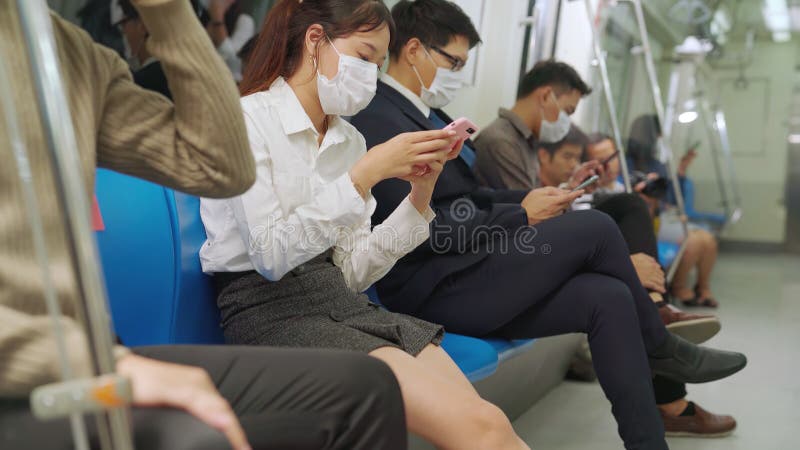 Crowd Of People Wearing Face Mask On A Crowded Public Subway Train