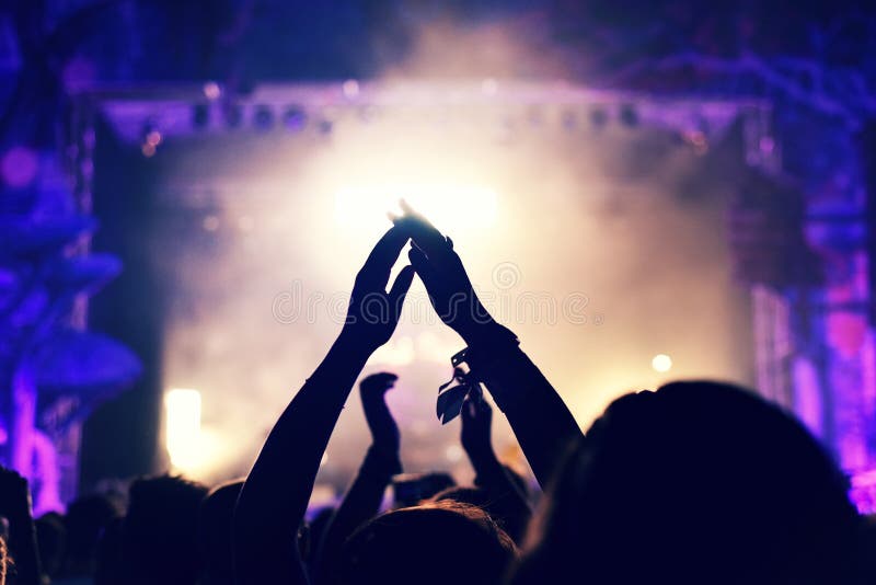 Crowd Rocking during a Concert with Raised Arms. Stock Image - Image of ...