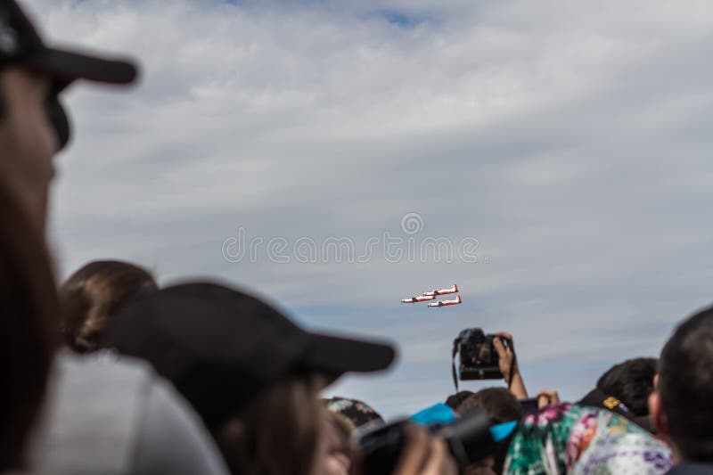 A Crowd of Spectators at an Airshow, Capturing a Flying Display of ...