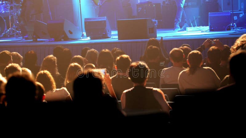 Crowd Spectators in Auditorium at a Rock Concert, Slow-motion Stock ...