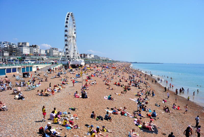 Crowded Brighton Beach with Brighton Wheel. Stock Image - Image of ...