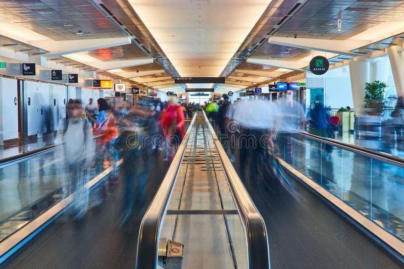 Crowded Moving Sidewalks Side by Side with Artistic Blur of People ...