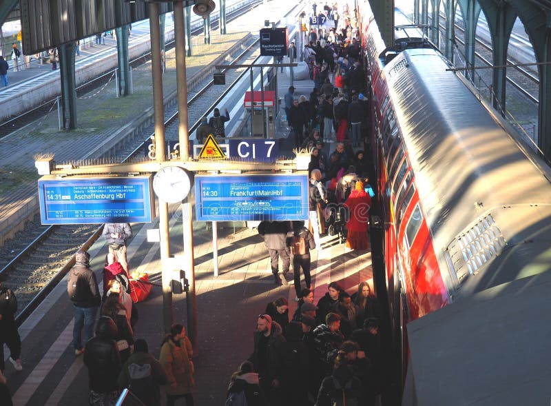 Crowded Platform with Red Train in Winter Editorial Photography - Image ...