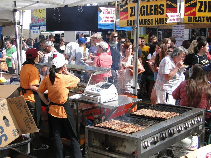 Crowds sample the food editorial stock image. Image of lunch - 19998249