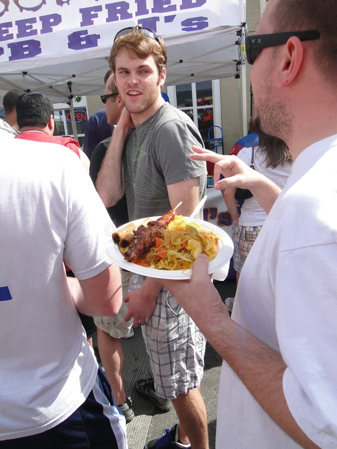 Crowds sample the food editorial stock photo. Image of crowd - 20557658